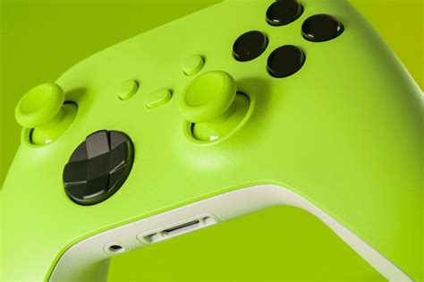 Premium Photo Green Game Controller On Green Background