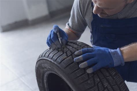 Mechanic Checking Tire Tread Depth And Wear Stock Photo Image Of Measuring Measurement