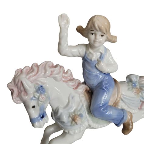 Young Girl Riding On Beautiful Adorned Rocking Horse Porcelain Figurine