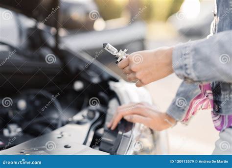 Woman Replacing A Broken Headlight Bulb Stock Image Image Of Automobile Changing