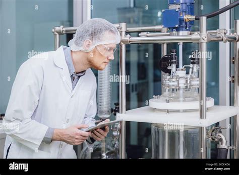 Scientist Staff Working With Equipment In Science Lab Medical Factory