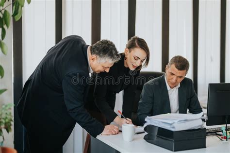 Business Professionals Collaborating On A Project In A Modern Office