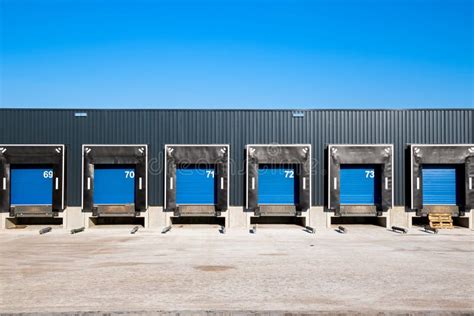 row of loading docks with shutter doors at an industrial warehouse