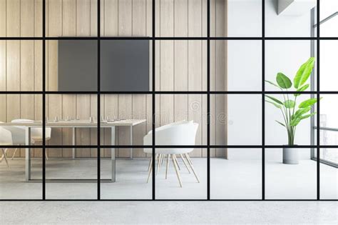 Modern Conference Room Interior Viewed Through Square Glass Partitions Clean And Minimalist