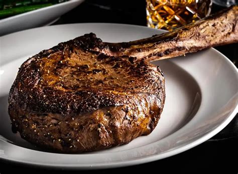 7 Steakhouse Chains Serving The Best Tomahawk Steaks
