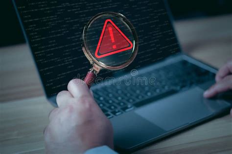Hacker Or Programmer Using Laptop With Triangle Caution Warning Sign Coding Cryptography Stock