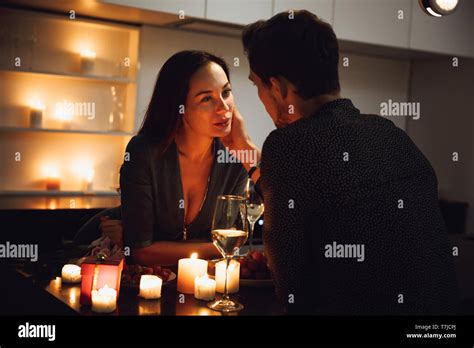 Beautiful Passionate Couple Having A Romantic Candlelight Dinner At