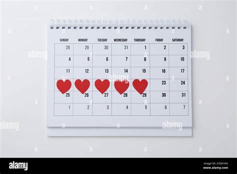 Menstruation Calendar With Marked Dates On White Background Top View