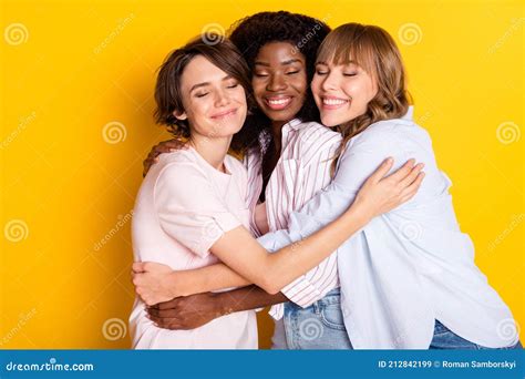 Portrait Of Three Positive Pretty Girls Closed Eyes Hugging Toothy