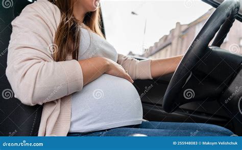Pregnant Driving Car. Young Smiling Pregnancy Woman Driving Car. Safety Pregnant Young Mom ...
