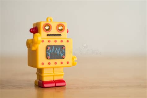 Yellow Cute Retro Ai Robot Toy On Wooden Background Copy Space Stock Image Image Of Future