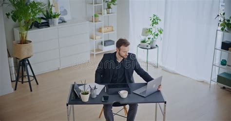 Businessman Walking Towards Desk And Working In Office Stock Footage