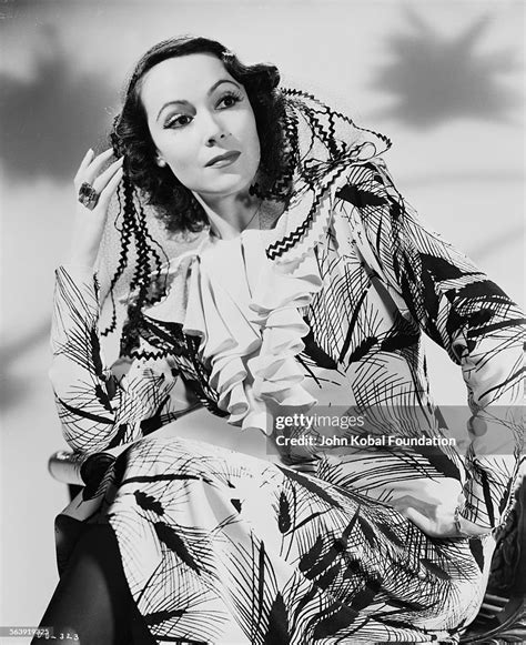 Portrait Of Actress Dolores Del Rio Wearing A Patterned Dress With A