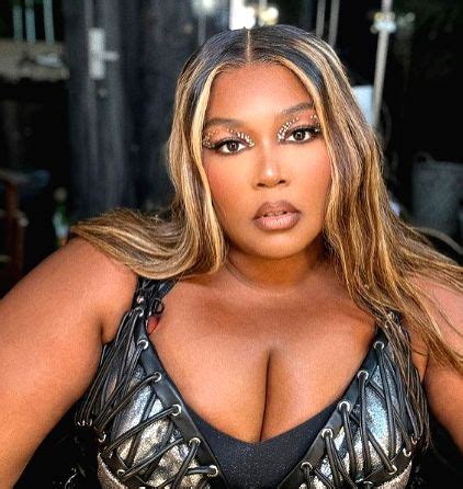 Lizzo Removes Skirt On Stage Slips Into Lace Up Black Leather Bodysuit