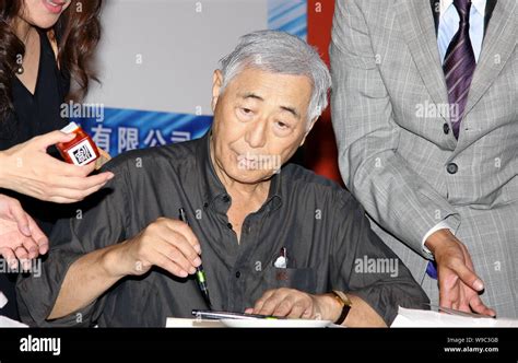 Japanese Writer Junichi Watanabe Signs For Fans During A Book Signing Event To Promote His Four