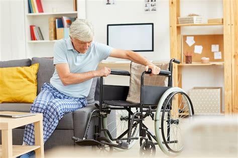 Premium Photo Disabled Man Trying To Stand Up