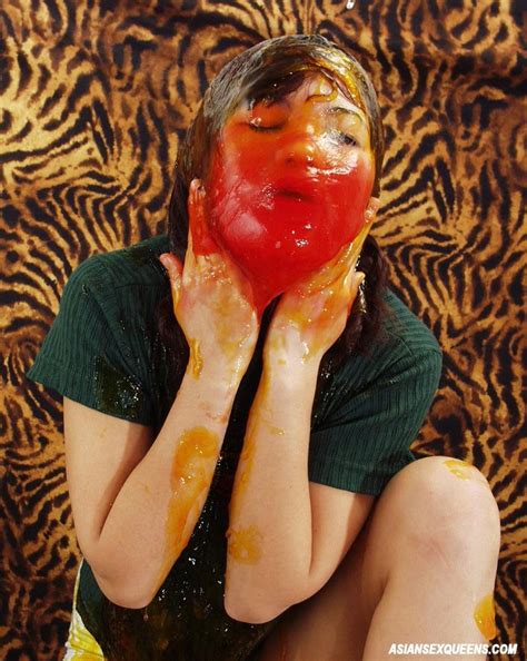 Kinky Asian Chick Covered Herself With Fruit Juices Photos