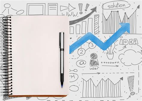premium photo blank notebook and pen on graph background