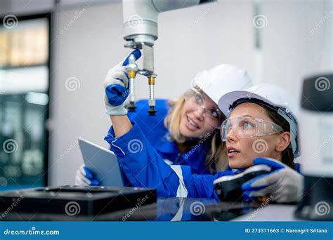 Close Up Two Professional Technician Or Engineer Women Sit And Help To