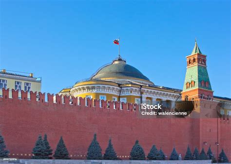 Moscow Kremlin Wall With Tower Building Dome And Russian Flag Stock