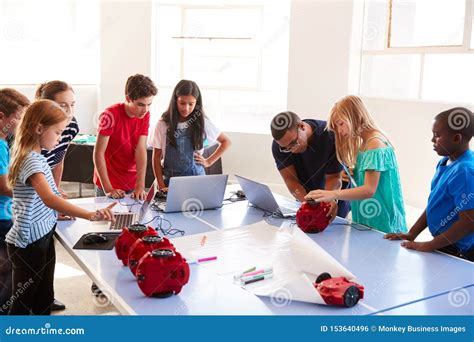 Group Of Students In After School Computer Coding Class Learning To Group Of Students In After School Computer Coding Class Learning To