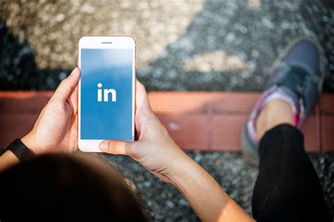 hands holding smartphone linkedin application free photo rawpixel