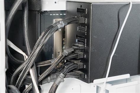 Close Up Of Modular Power Supply Unit With Connected Braided Cables Inside Pc Case During
