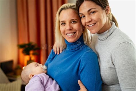 Happy Lesbian Couple With Small Baby At Home Portrait Stock Photo Image Of Couple Babe