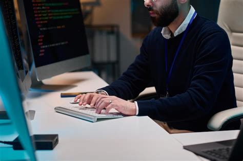premium photo software developer writing code typing on keyboard