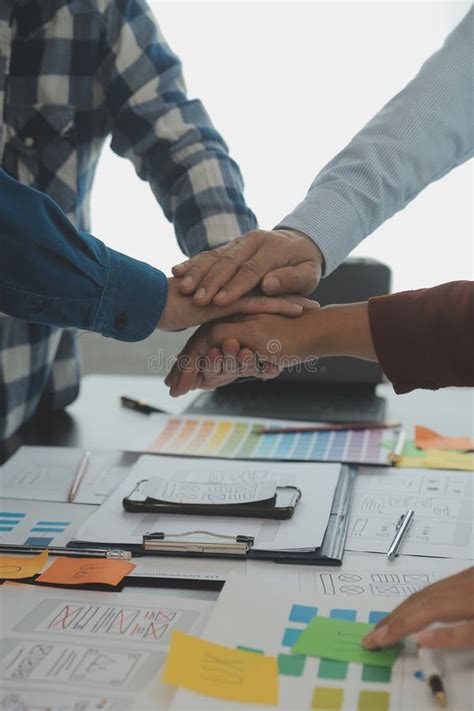 Close Up Ux Developer And Ui Designer Brainstorming About Mobile App