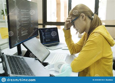 Young Woman Covering Her Face With The Stress Of Work Coding And