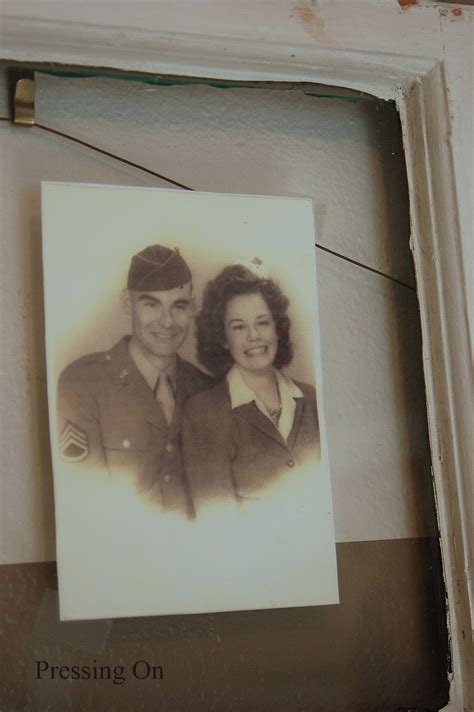 Pressing On Old Photos In A Window