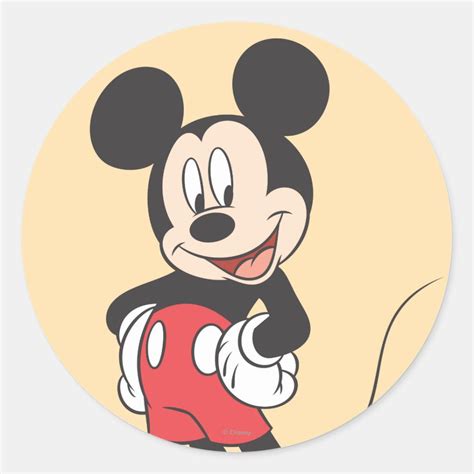 A Mickey Mouse Sticker With An Image Of The Character Pointing At Its Left Side