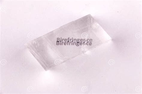 Optical Birefringence Demonstrated Using A Text Using A Natural Double Spar Calcite Crystal