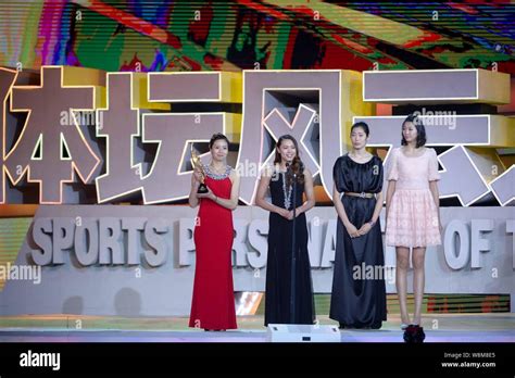Chinese Race Walker Liu Hong Left Holds Her Trophy For The Best Female Athlete At The Award