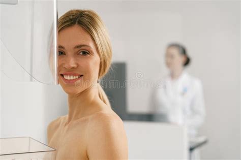 Young Woman Doing Mammogram X Ray For Breast Cancer Prevention Screening At Modern Hospital