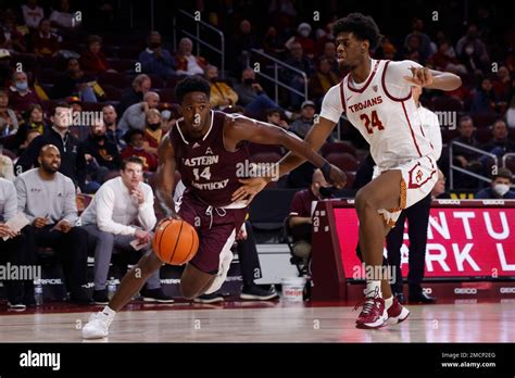 Eastern Kentucky Forward Devontae Blanton 14 Drives Against Southern California Forward Joshua