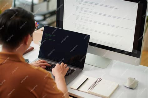 Premium Photo Software Developer Testing Programming Code To Identify Bugs Or Errors