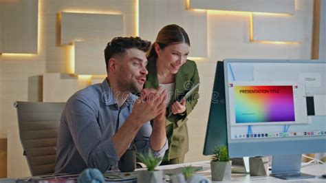 Smiling Partners Discussing Design Project In Contemporary Office Close