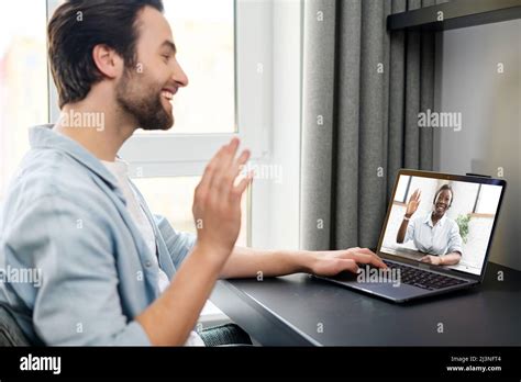 Virtual Conference Webinar Young Caucasian Man Waves Hello To His