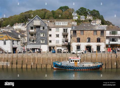 Looe Cornwall View In Summer Of Waterfront Shops And Property Sited In Quay Street In The