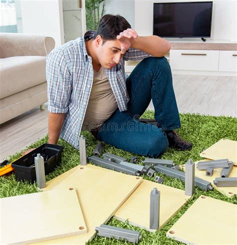 Man Assembling Furniture At Home Stock Image Image Of Fasten