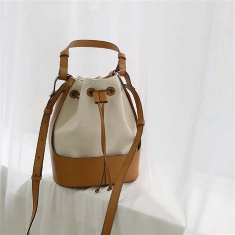 Yimma 소가죽 X 캔버스 벌룬 버킷백 1col 토트 겸 숄더백 복조리 원통 가방