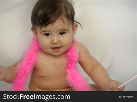 Naked Baby Girl Sitting And Smiling With Pink Free Stock Images