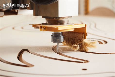 Numerically Controlled Woodworking Machine Cuts Rounded Complex Lines On The Canvas Computer