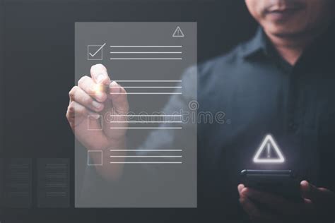 Businessman Checking Steps Through Online Document With Check Box List