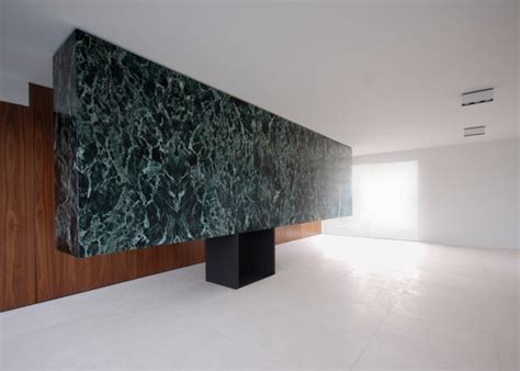 Monolithic Marble Partition Divides Antwerp Penthouse