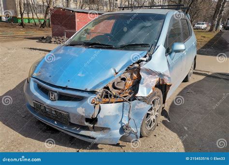Honda Car After A Car Accident Parked On The Street Headlamp Broken