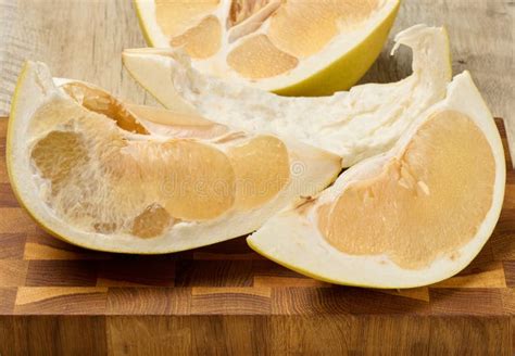 A Fresh Juicy Slice Of Pomelo Fruit With Visible Pulp And Peel Citrus