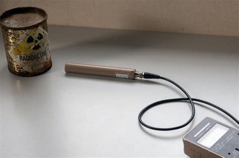 Premium Photo Hand Held Radiation Survey Instrument Detecting On